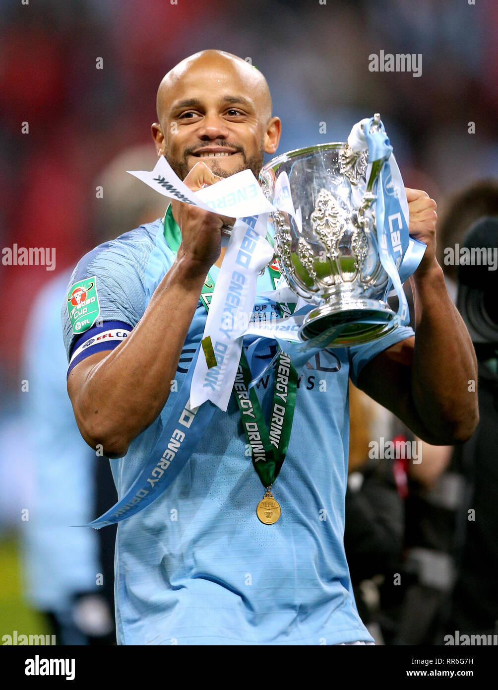 Manchester City Captain Vincent Kompany lifts the trophy after his team ...