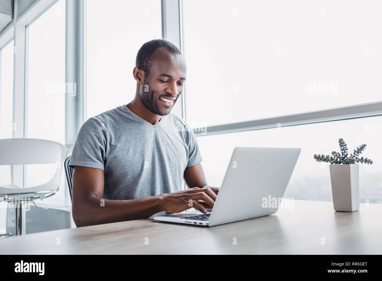 Professional male economist searches needed information on portable ...