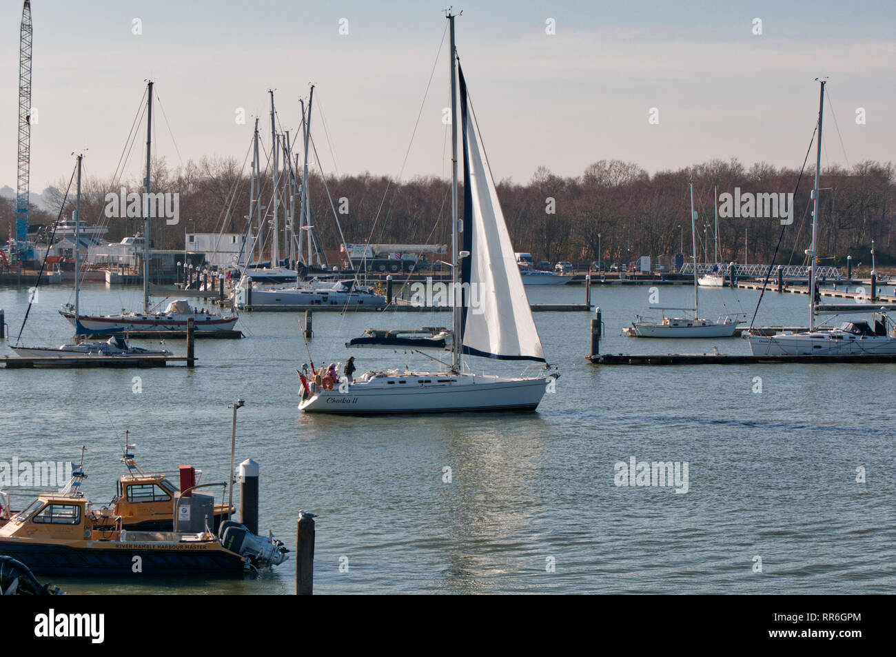A yacht sails on foresail up the River Hamble Stock Photo - Alamy