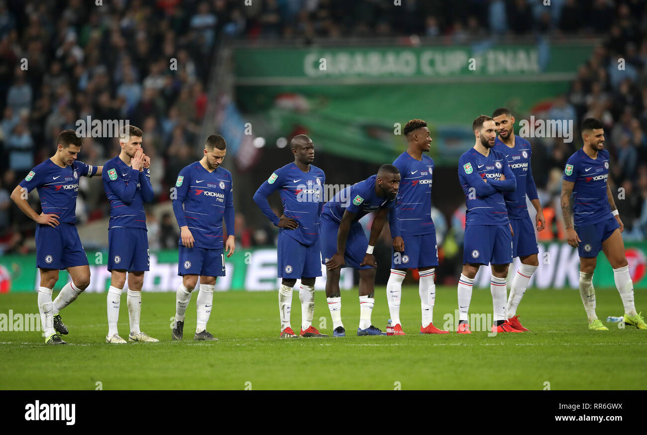 Chelsea players staff dejected as they watch the penalty shoot-out ...