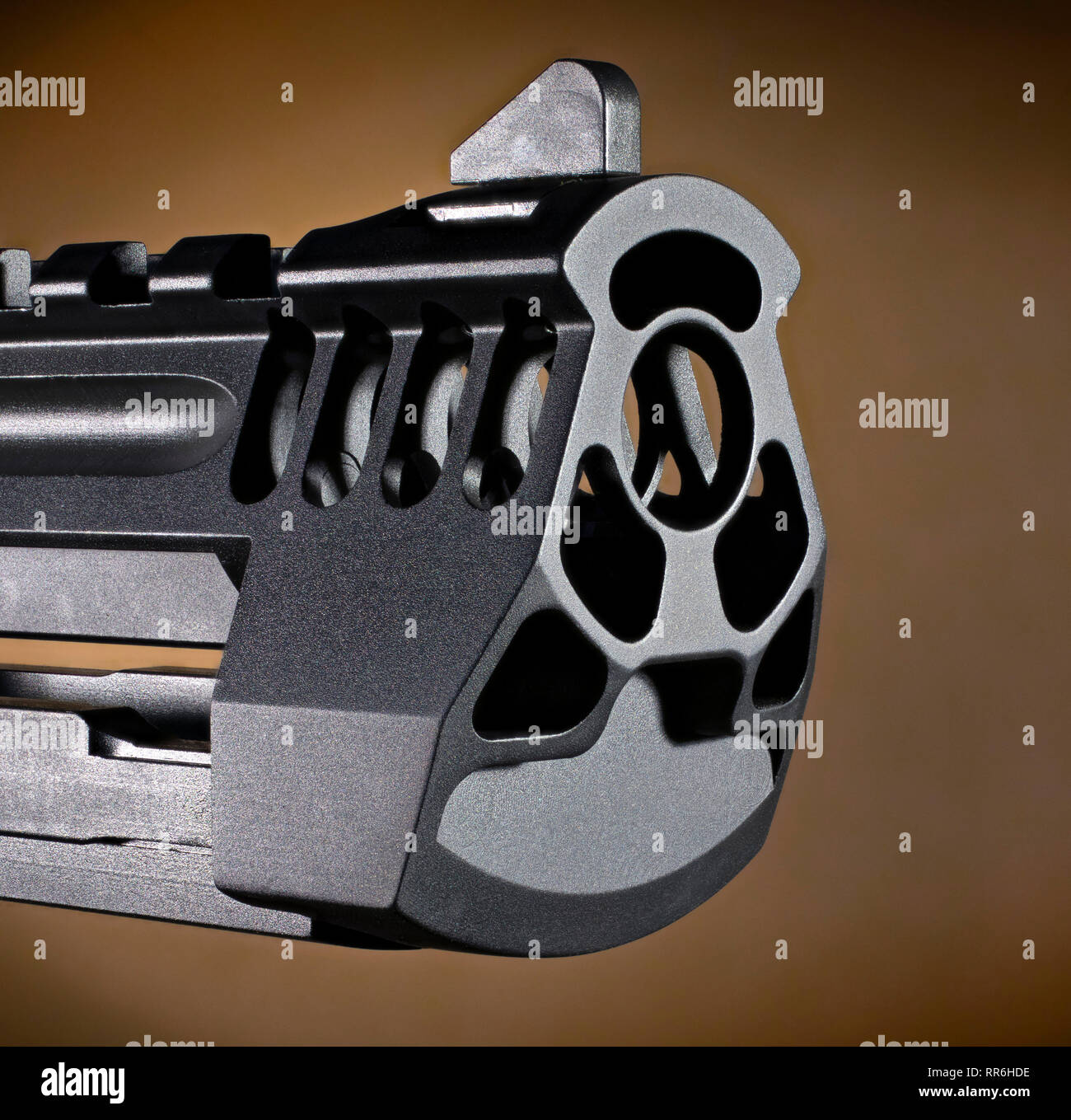 Semi automatic handgun muzzle with a brown background Stock Photo - Alamy