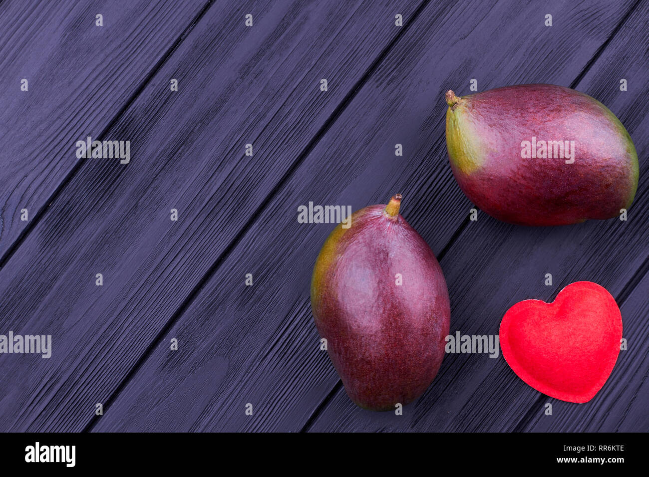 Mango, felt heart and copy space Stock Photo - Alamy