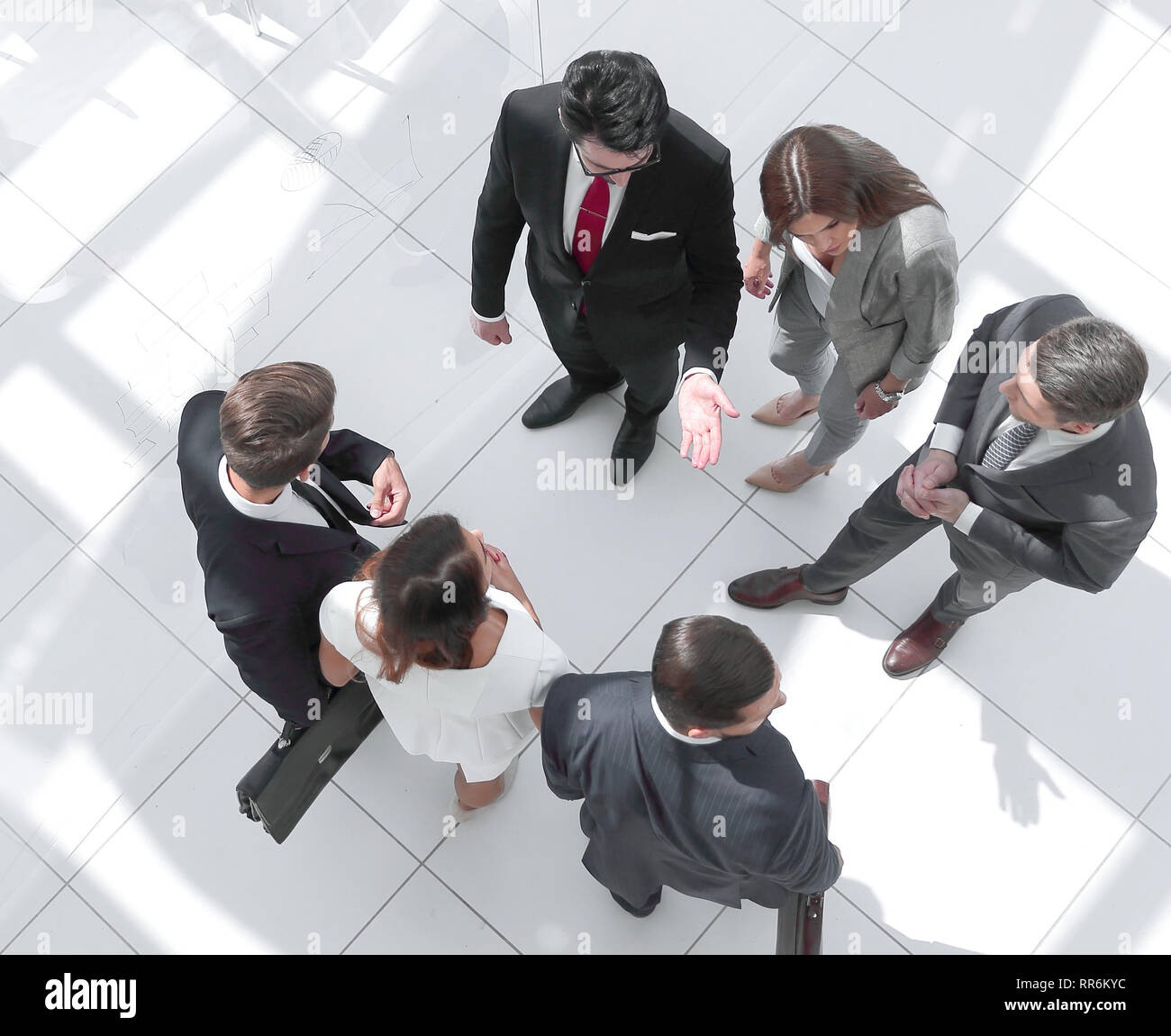 top view. employees standing in a modern office Stock Photo - Alamy