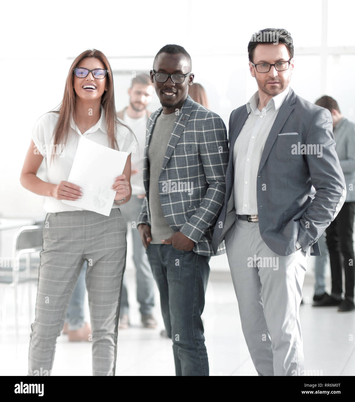 boss and employees of the company standing in the office Stock Photo ...