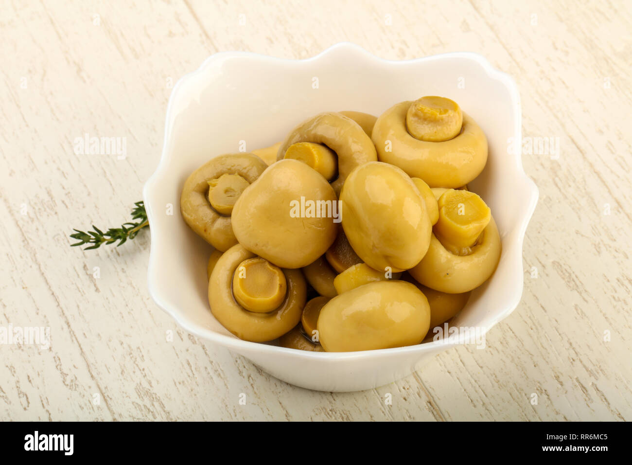 Marinated champignons in the bowl - ready for cooking Stock Photo - Alamy