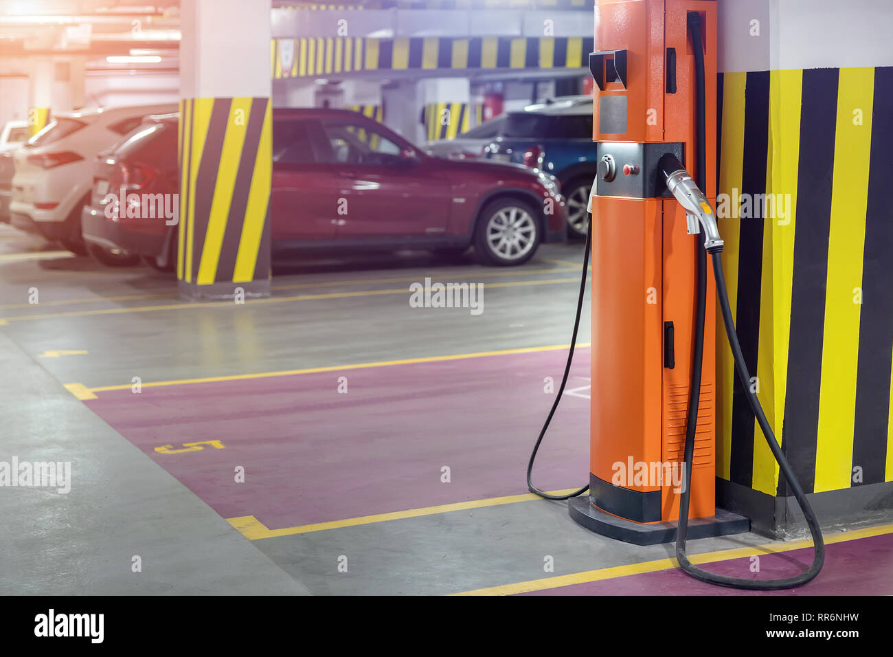 Electric car fast charging station at indoor underground parking. Power ...