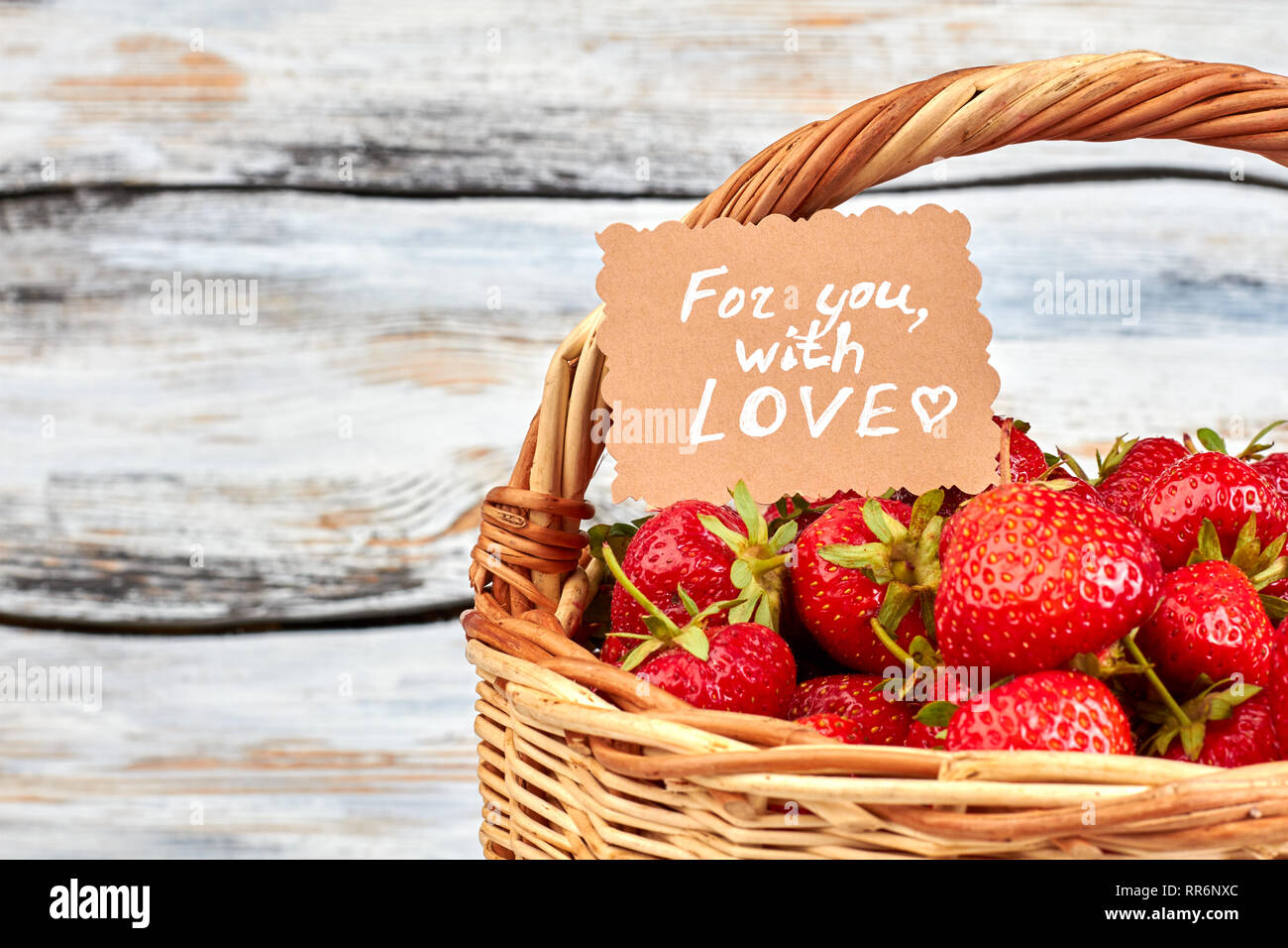 Strawberries in basket and romantic note Stock Photo - Alamy