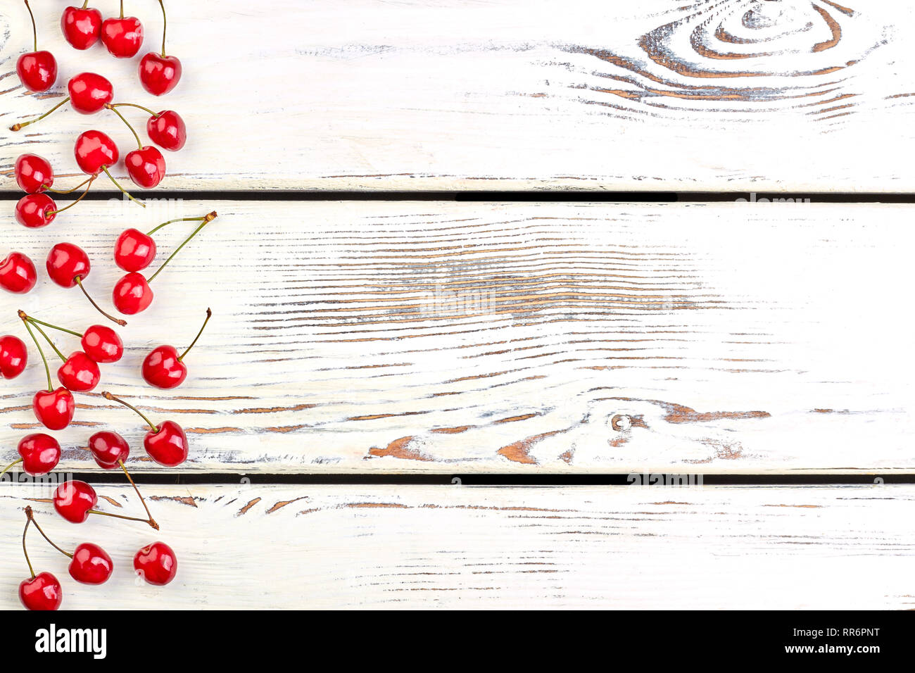 Side border from red cherries and copy space Stock Photo - Alamy