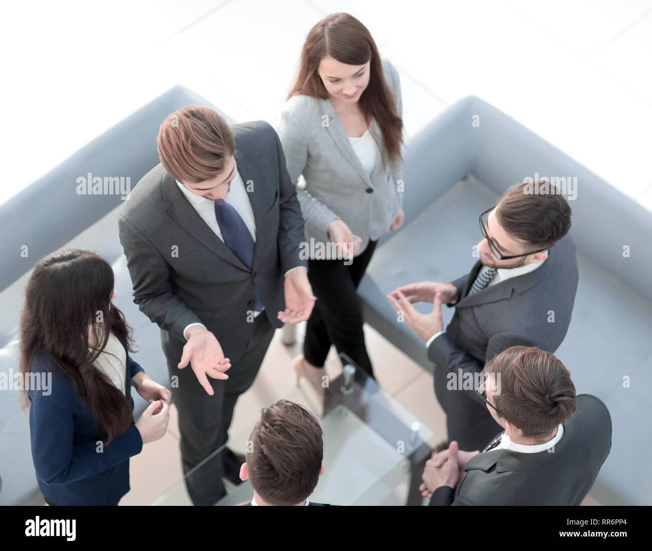 Happy smiling business team standing in a row at office Stock Photo - Alamy