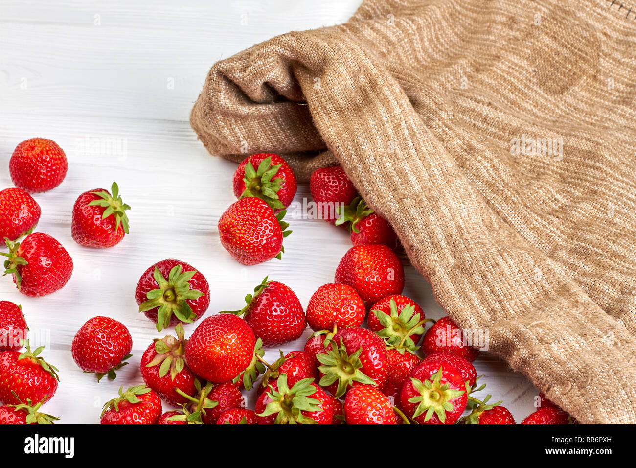 Fresh strawberries scattered on white background Stock Photo - Alamy