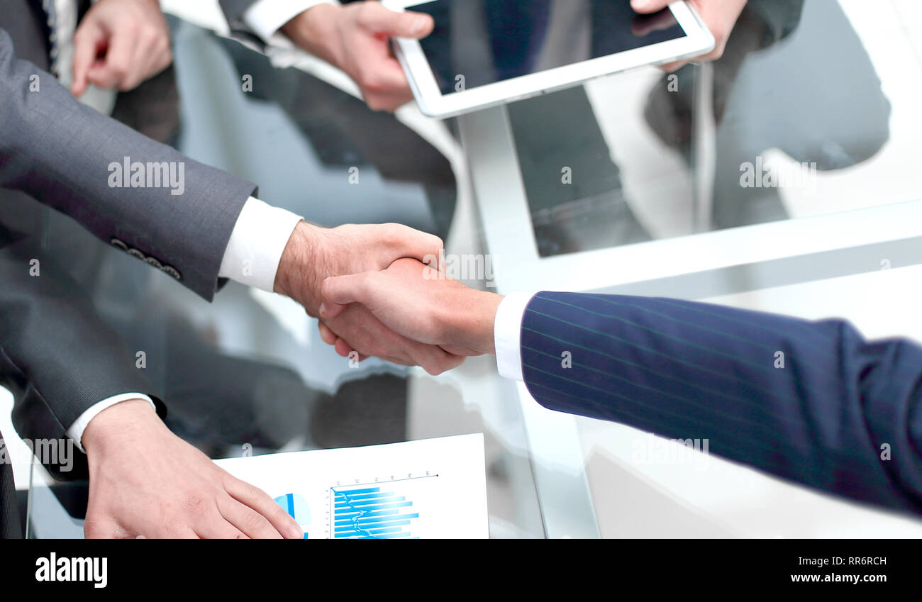 close up. investor and businessman shaking hands Stock Photo - Alamy