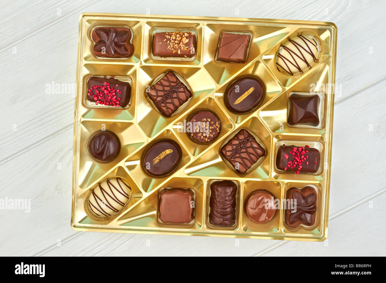 Chocolate candies in box, top view Stock Photo - Alamy