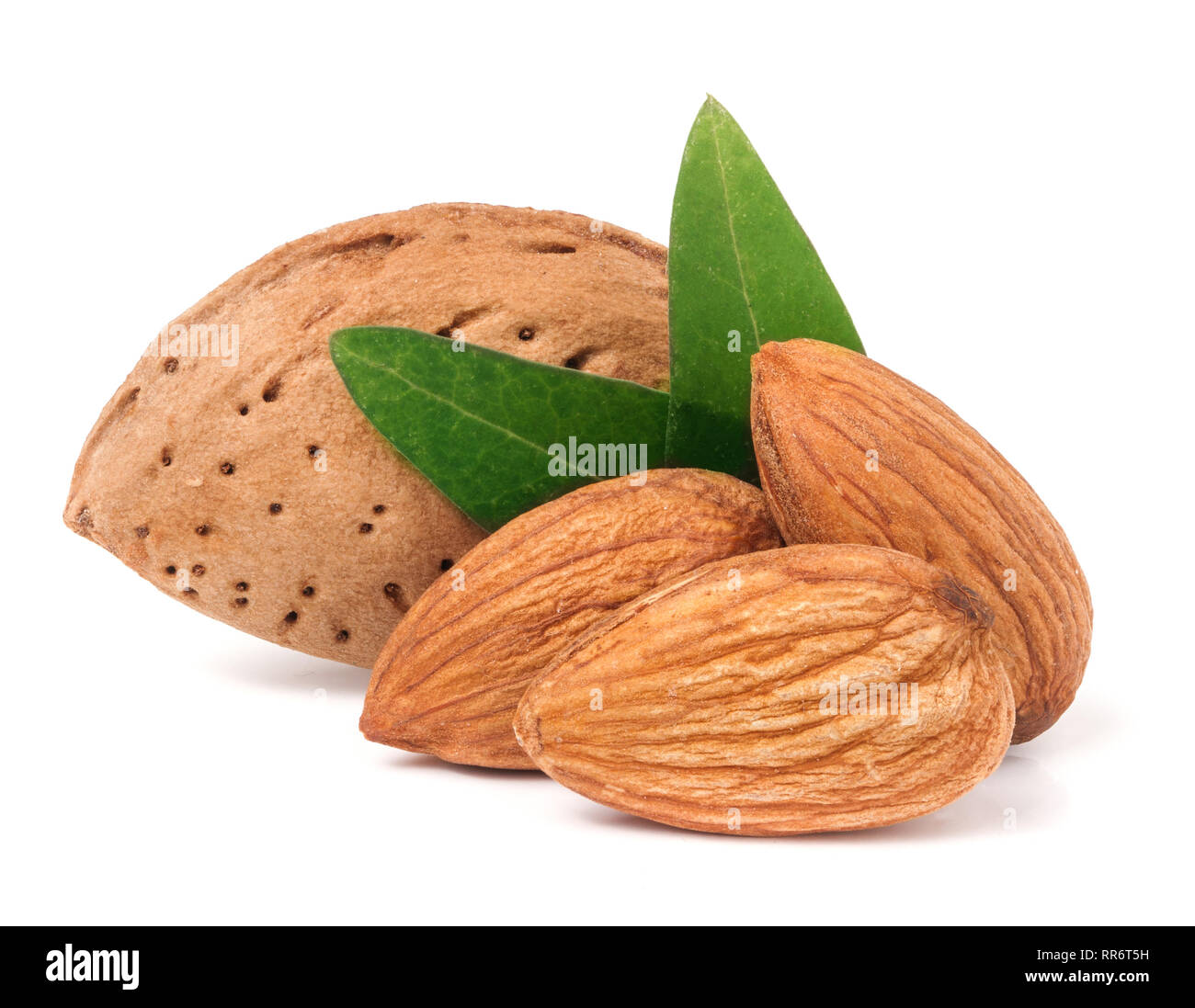 almonds in their skins and peeled with leaf isolated on white ...
