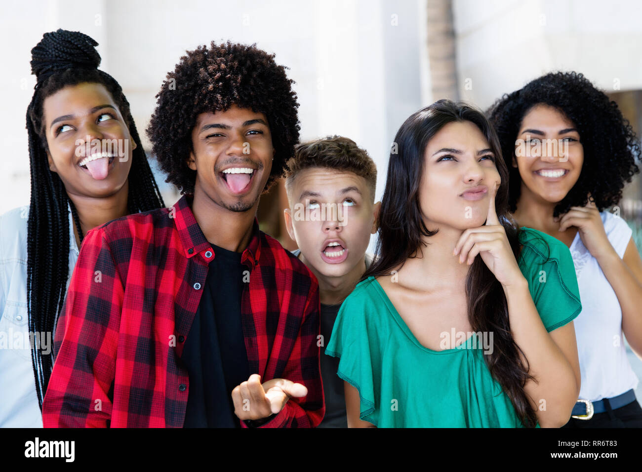 Group of funny multi ethnic young adults outdoor in the city Stock ...