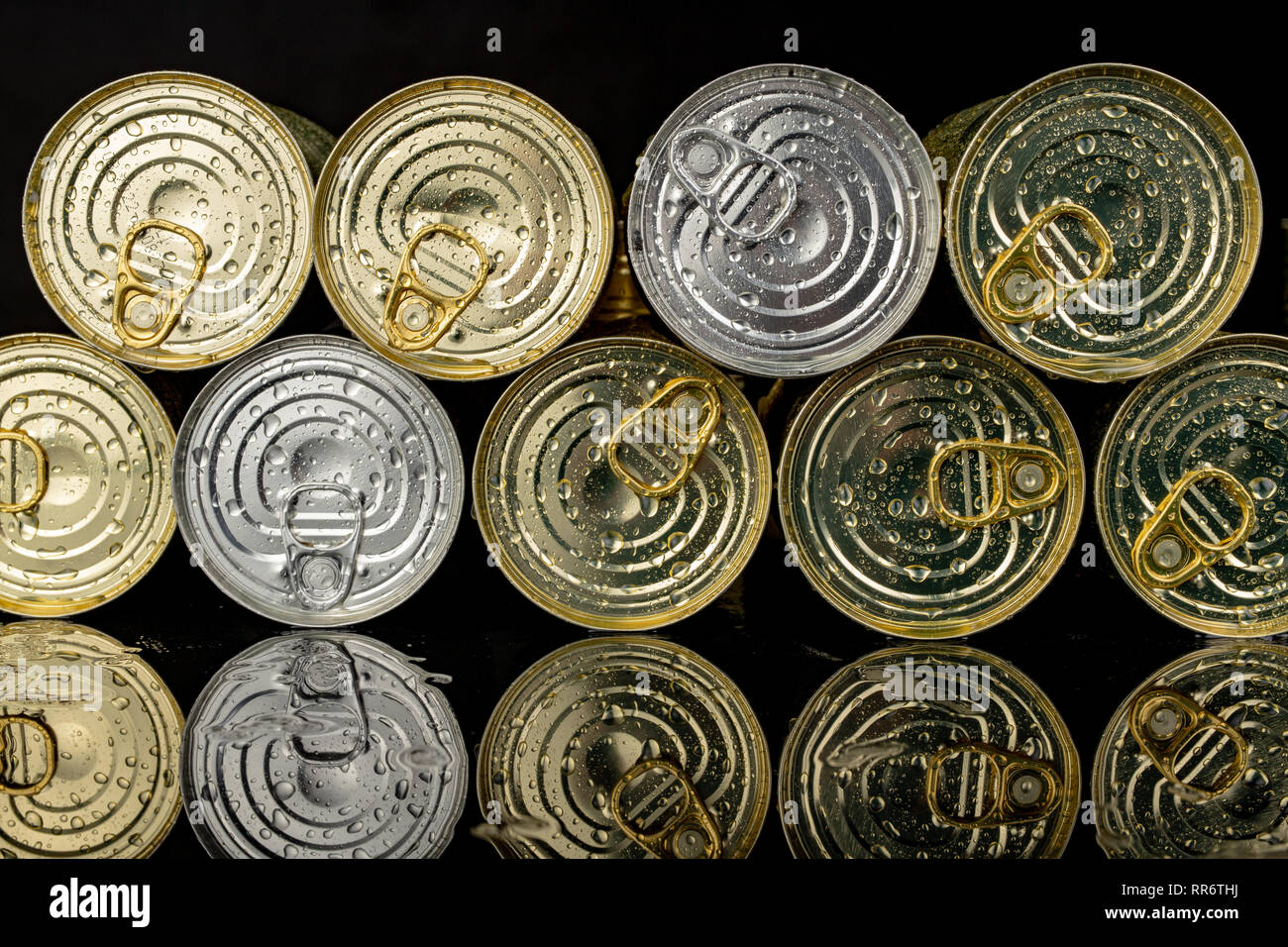 A wet can with vegetables. Drops of water on a metal can lid. Dark ...