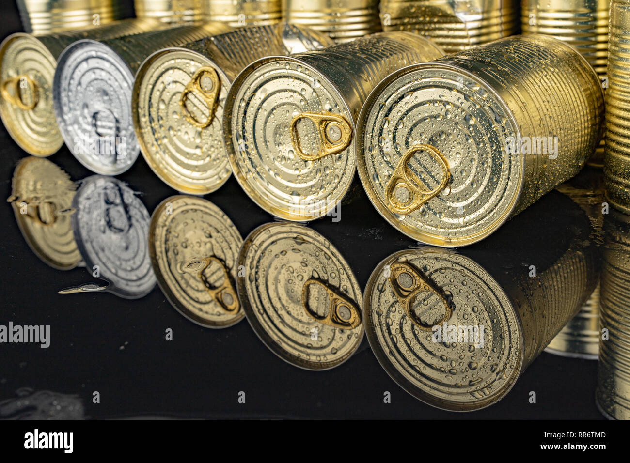 A wet can with vegetables. Drops of water on a metal can lid. Dark ...