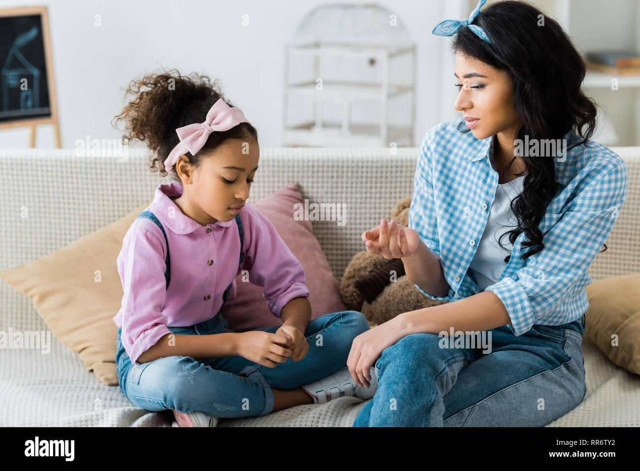 Serious girl child mother talking hi-res stock photography and images ...