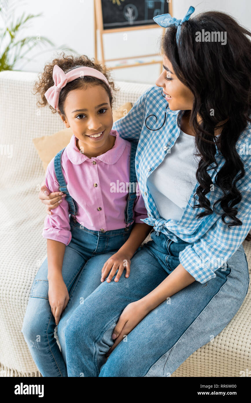 happy african american mother embracing adorable daughter Stock Photo - Alamy