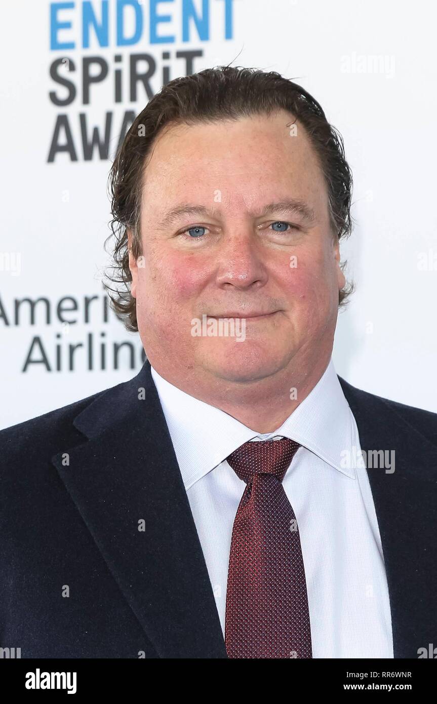 Greg Clark arrive at the Film Independent Spirit Awards in a tent in ...