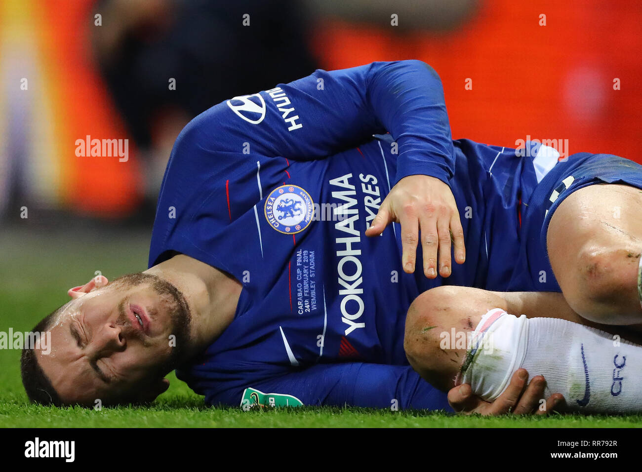 London, UK. 24th Feb, 2019. Eden Hazard of Chelsea lays injured after a ...