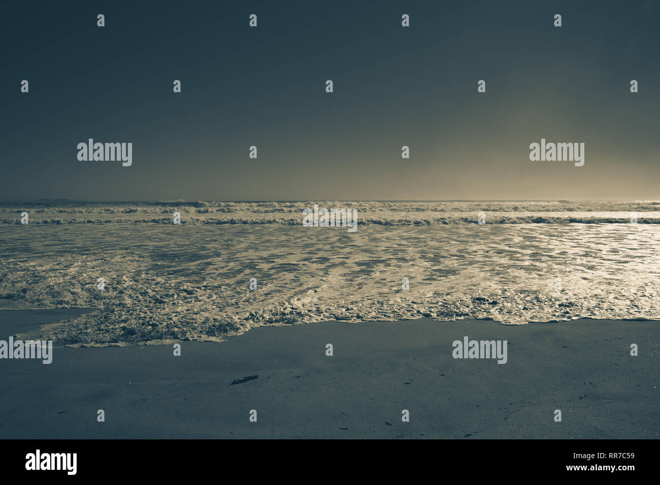 Dark split tone turbulent sea during strong ocean surge Stock Photo - Alamy