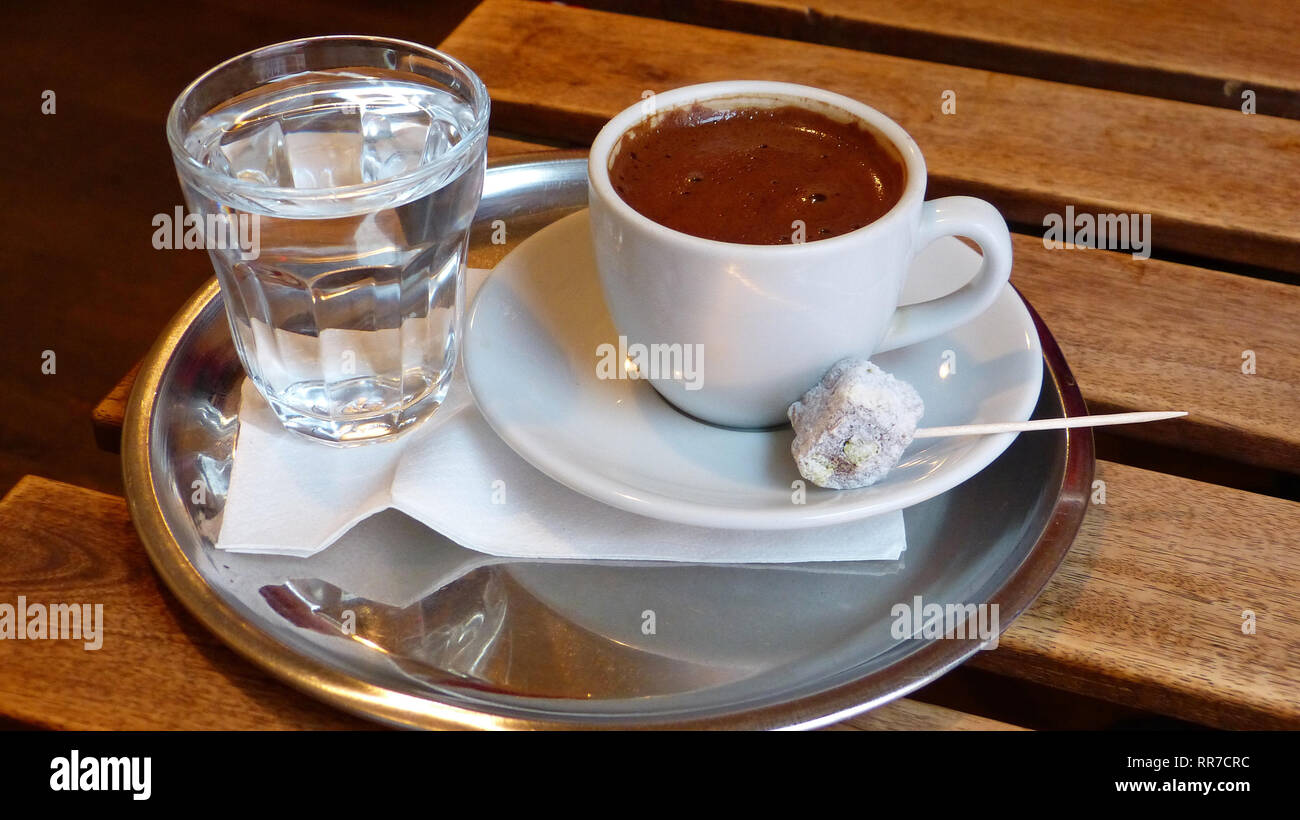 Cup of Turkish coffee with glass of water on a tray Stock Photo - Alamy