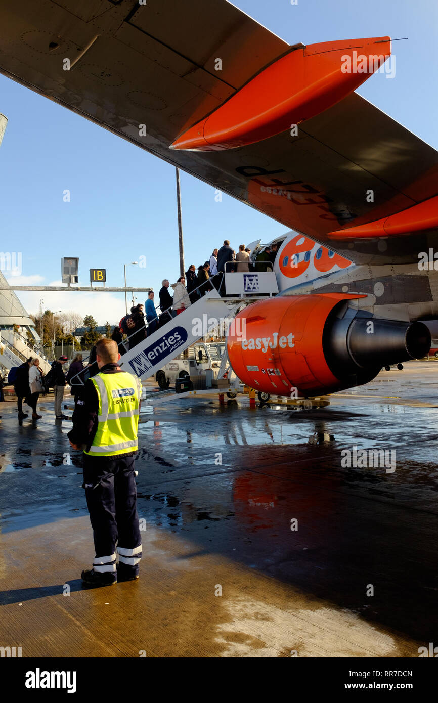 Passengers boarding an easyjet plane at Edinburgh airport viewed from ...