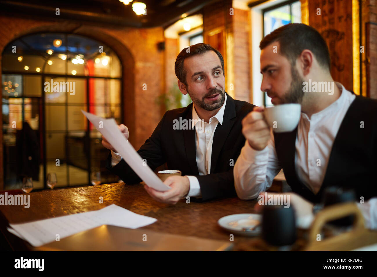 Executives Meeting in Restaurant Stock Photo - Alamy