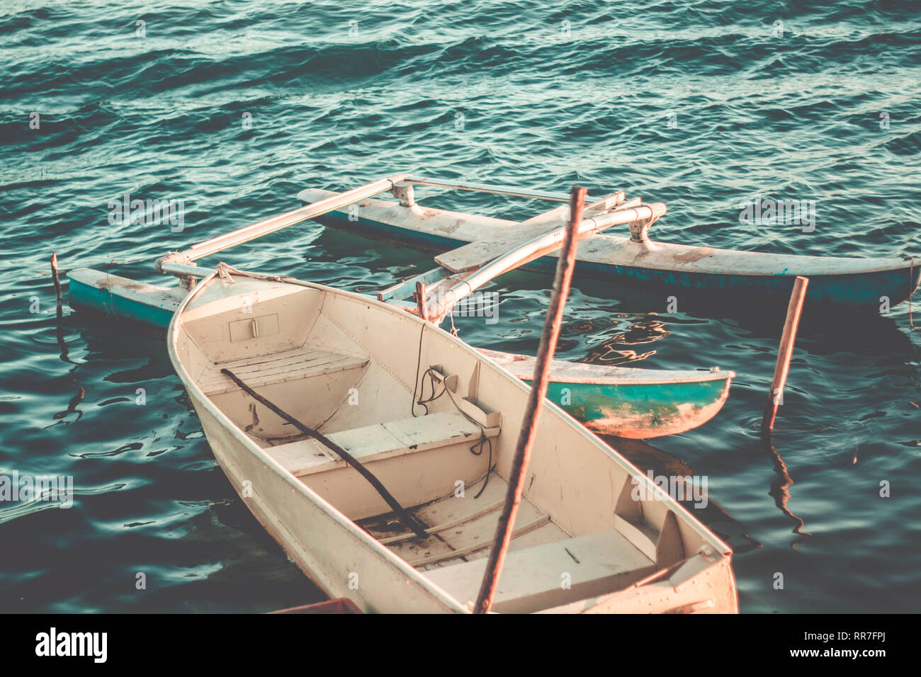Rustic old fishing boat on water Stock Photo - Alamy