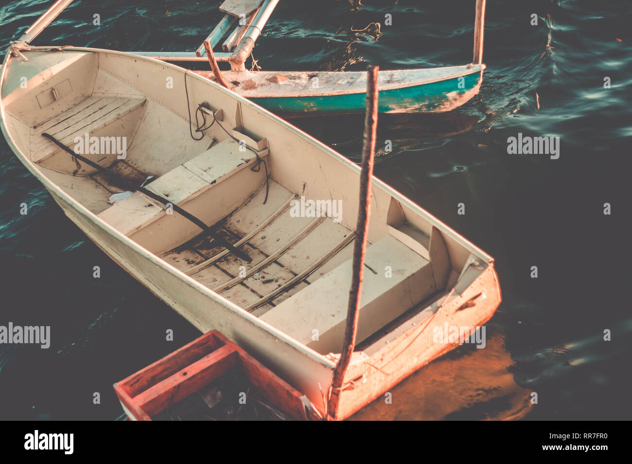 Rustic old fishing boat on water Stock Photo - Alamy