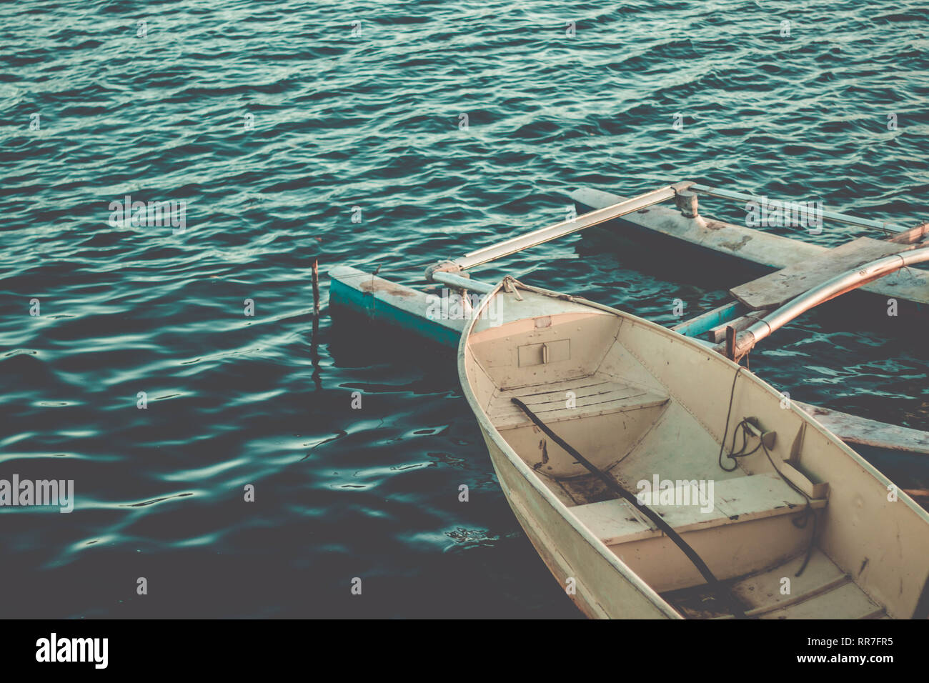 Rustic old fishing boat on water Stock Photo - Alamy