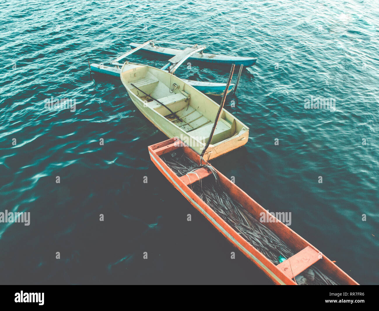 Rustic old fishing boat on water Stock Photo - Alamy
