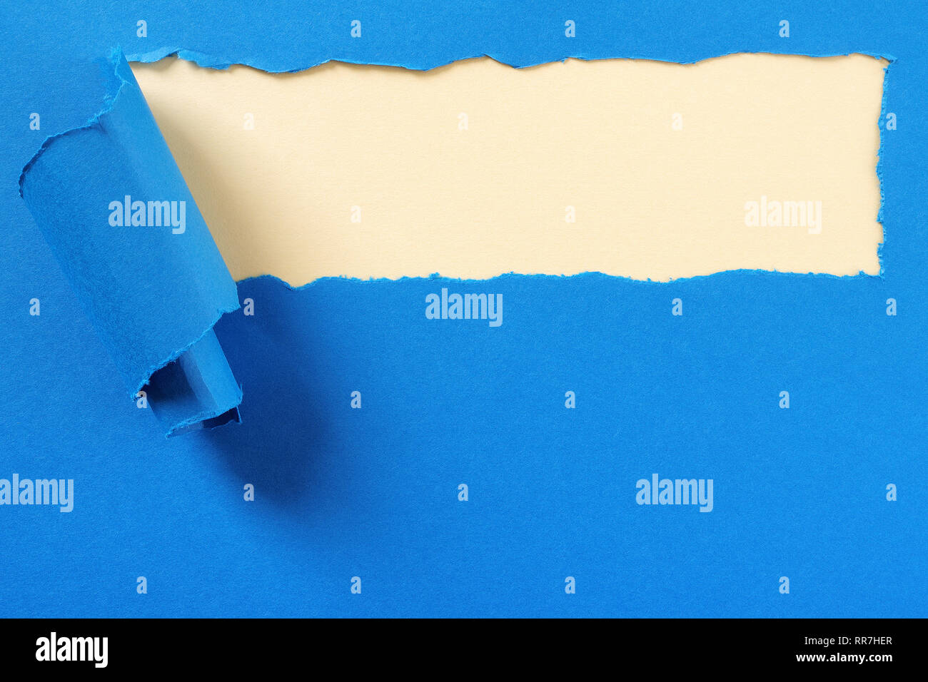 Torn blue paper strip yellow background frame Stock Photo - Alamy