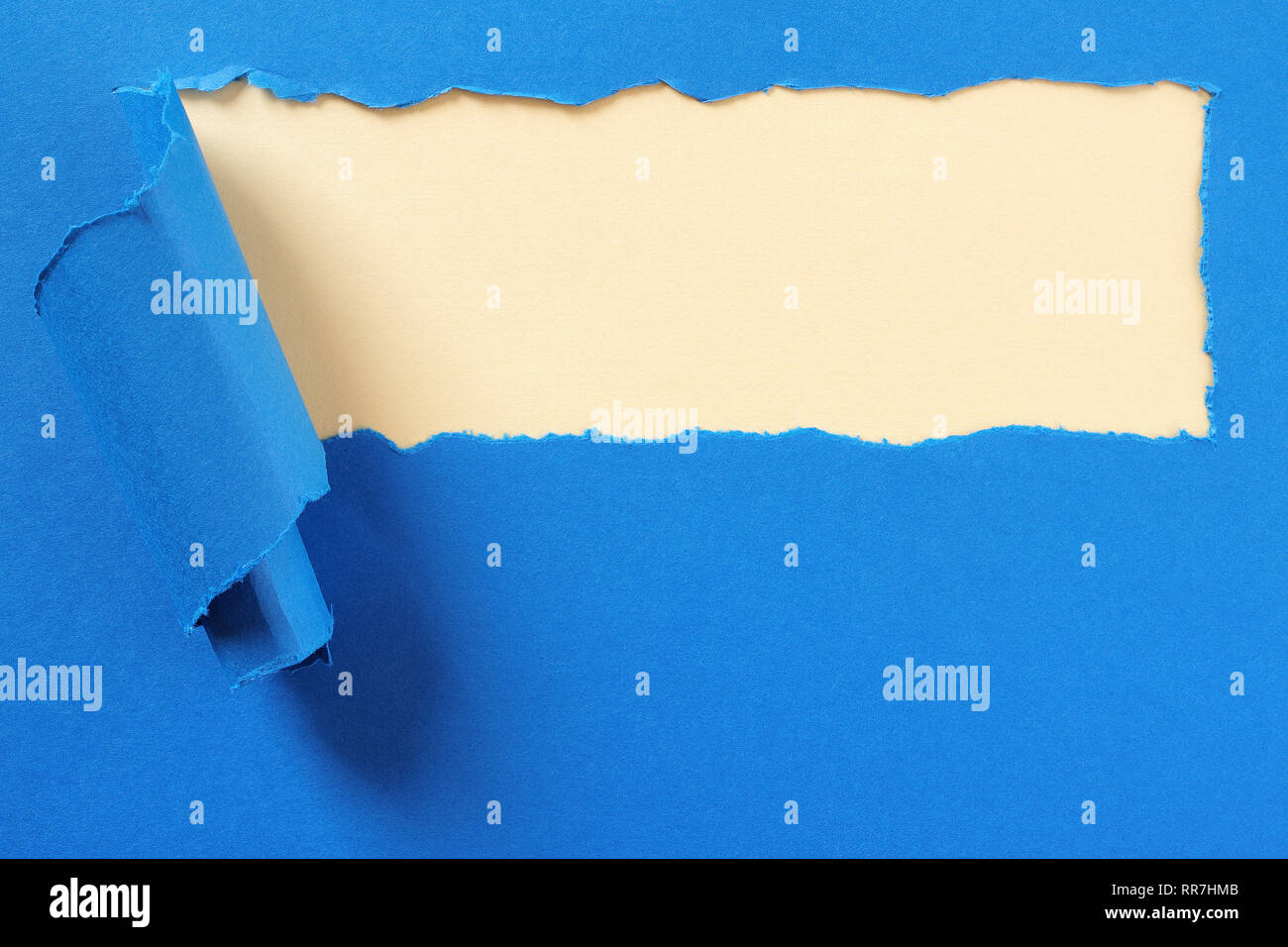 Torn blue paper strip yellow background frame Stock Photo - Alamy