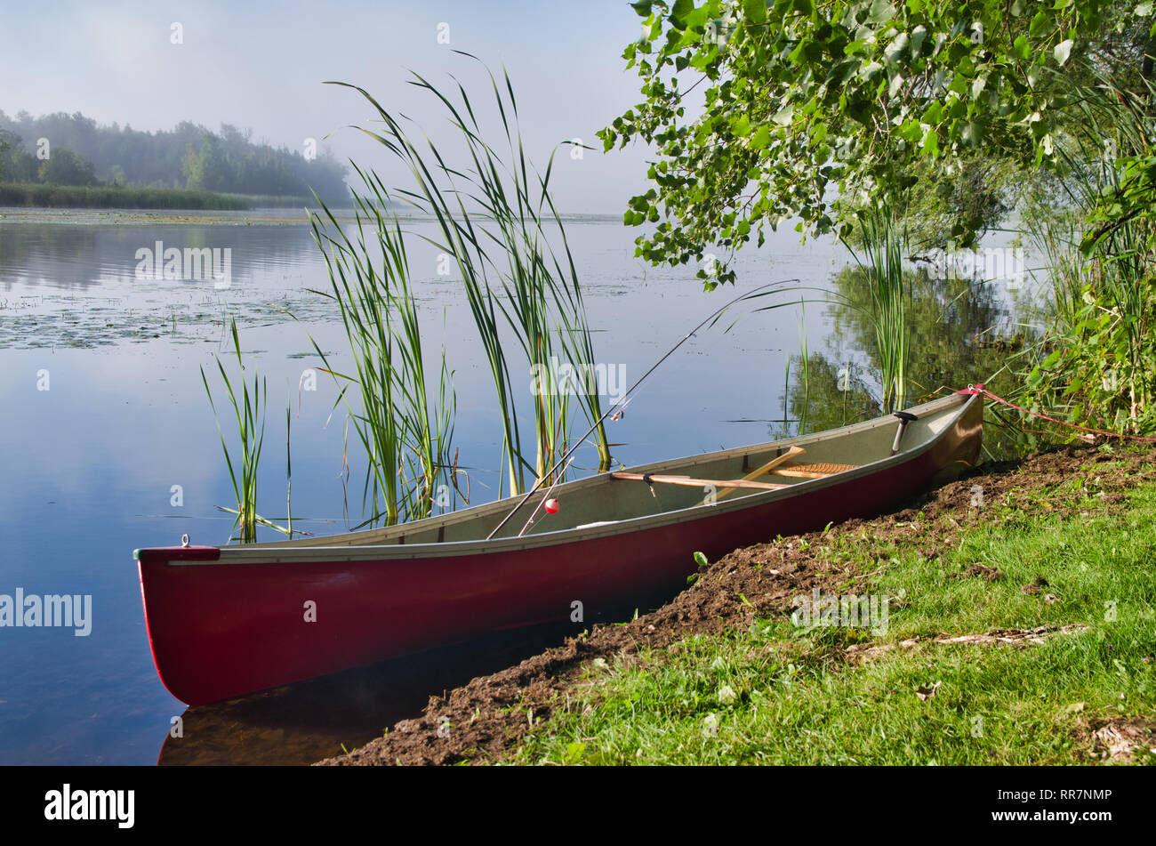 Ready to go fishing in a red canoe hi-res stock photography and images ...