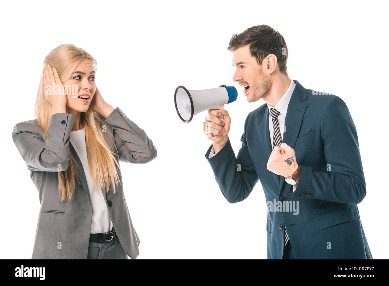 emotional businessman shouting with megaphone at frightened female ...