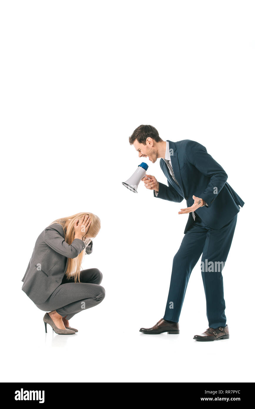 angry male boss yelling into megaphone at stressed female employee ...