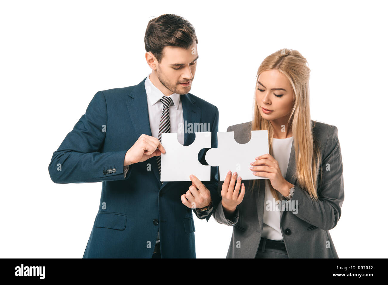 executive business team holding puzzle pieces isolated on white ...