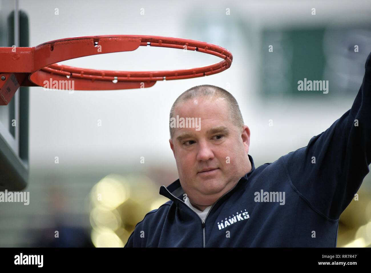 Coach participating in a traditional cutting down of the net following ...