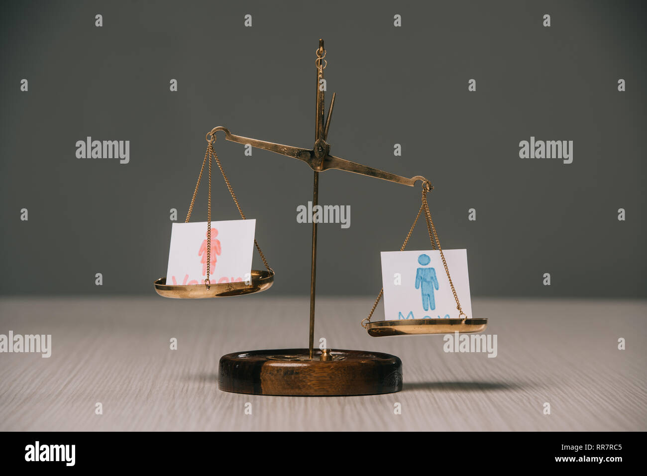 male and female signs on scales on grey, gender equality concept Stock ...