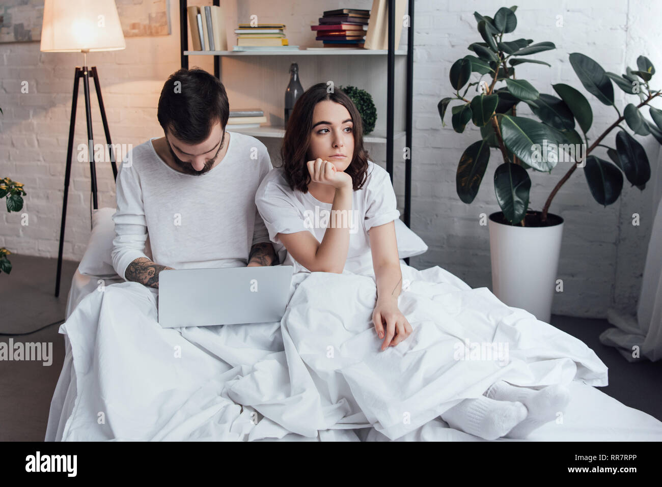 Woman bored couple in bed hi-res stock photography and images - Alamy