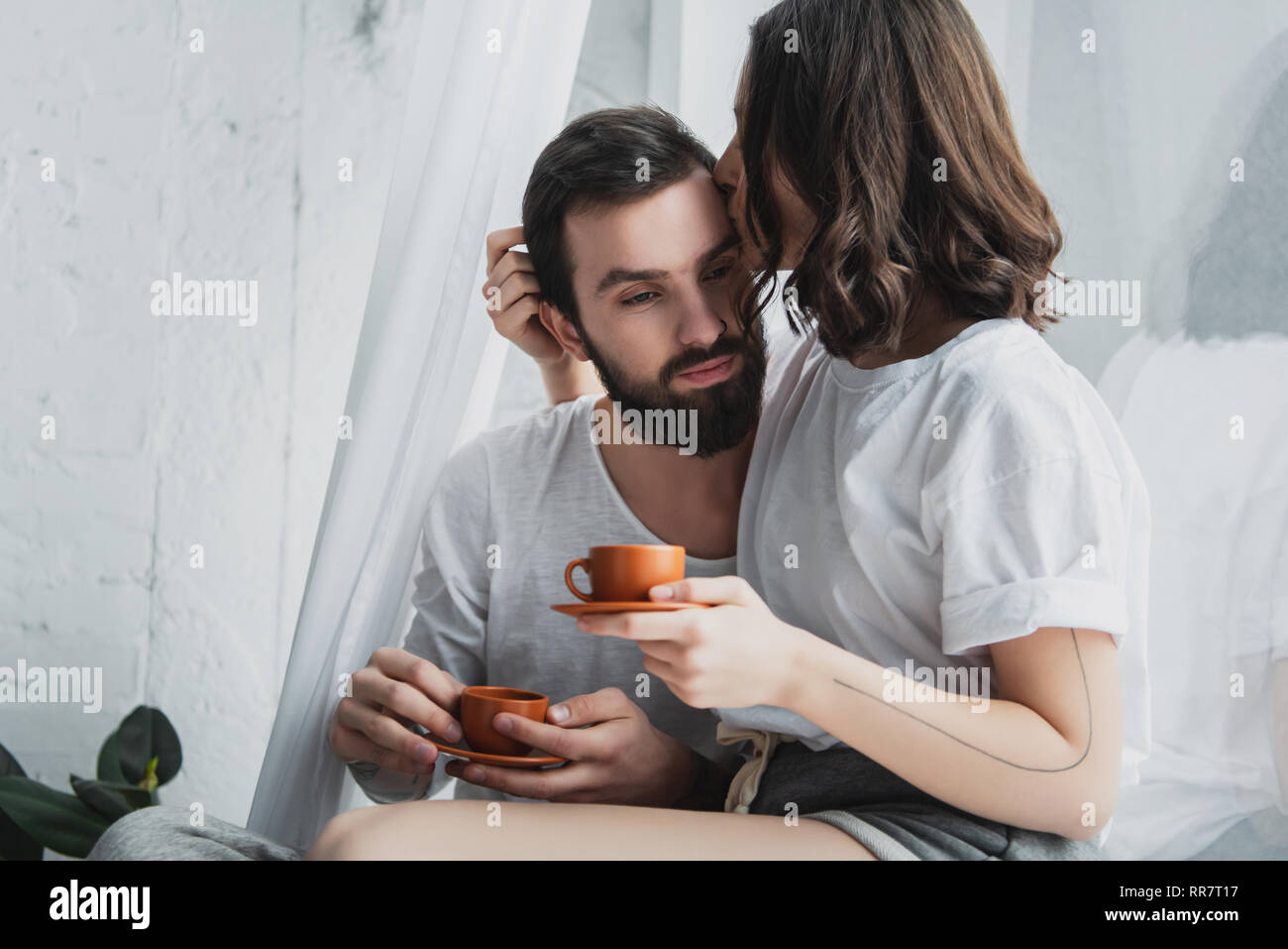 Couple kiss indoors home hi-res stock photography and images - Alamy
