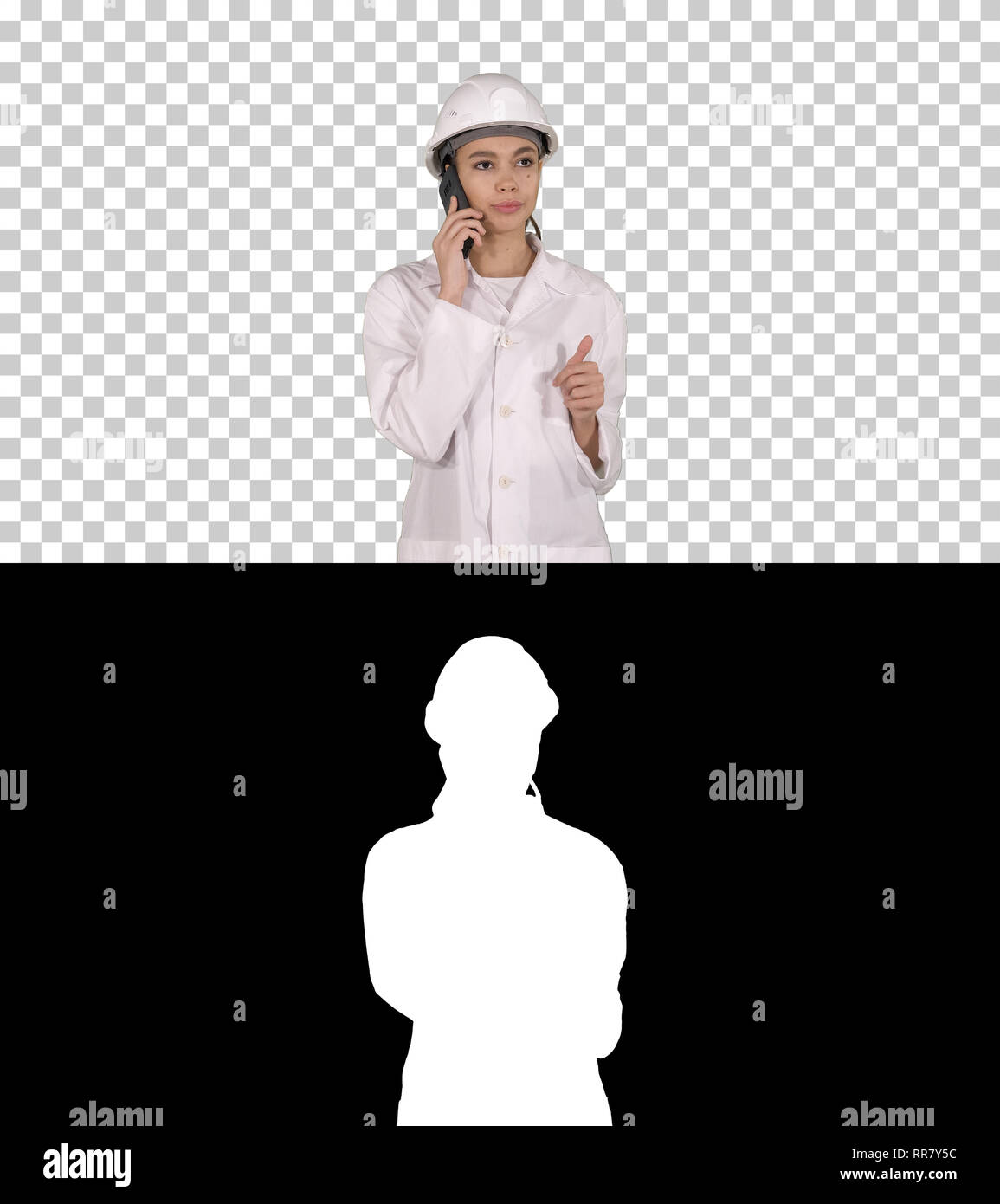 On Alpha Matte. Medium shot. Woman engineer talking on the phone while ...