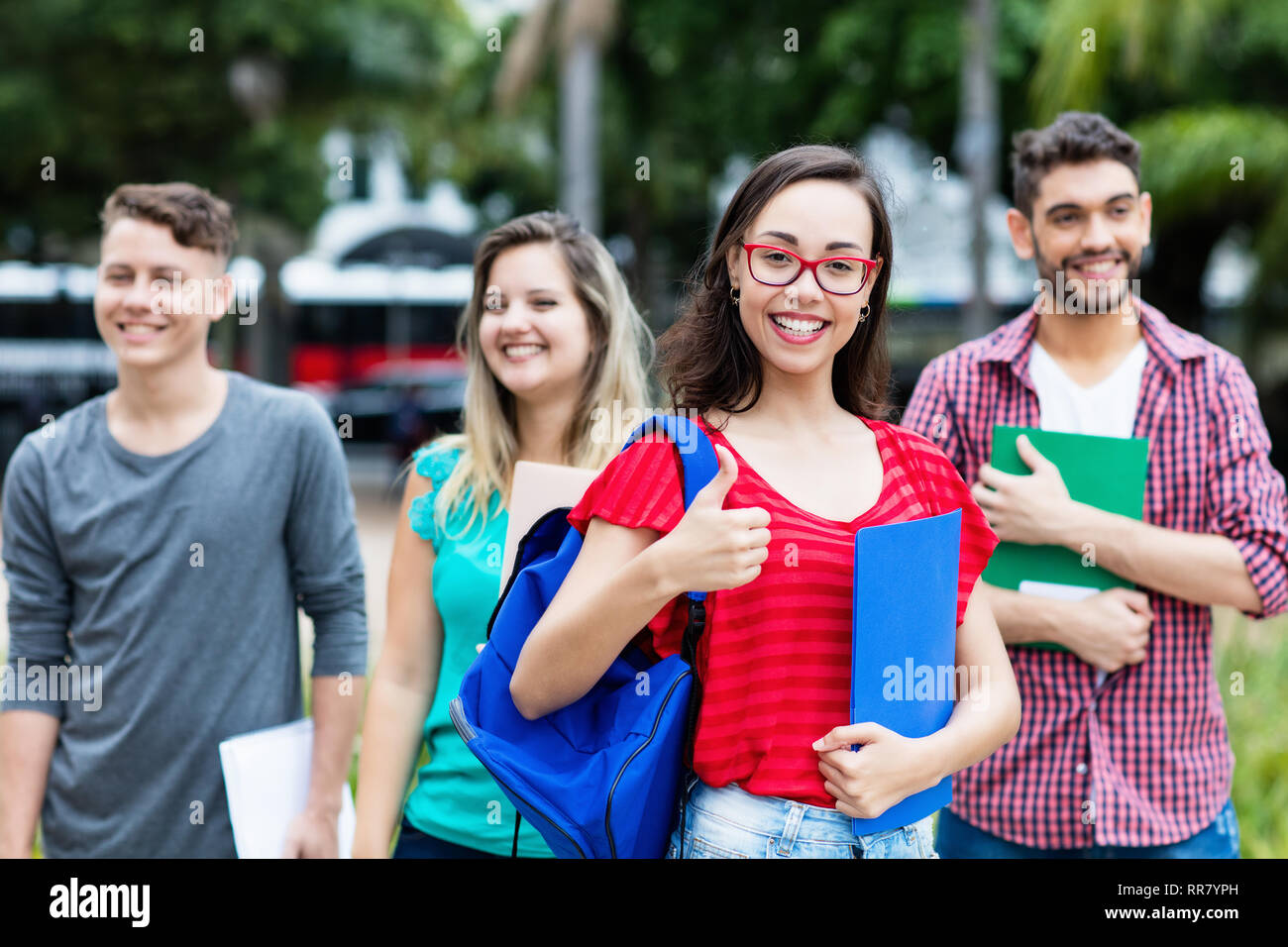 French female student with group of other students outdoor in the ...