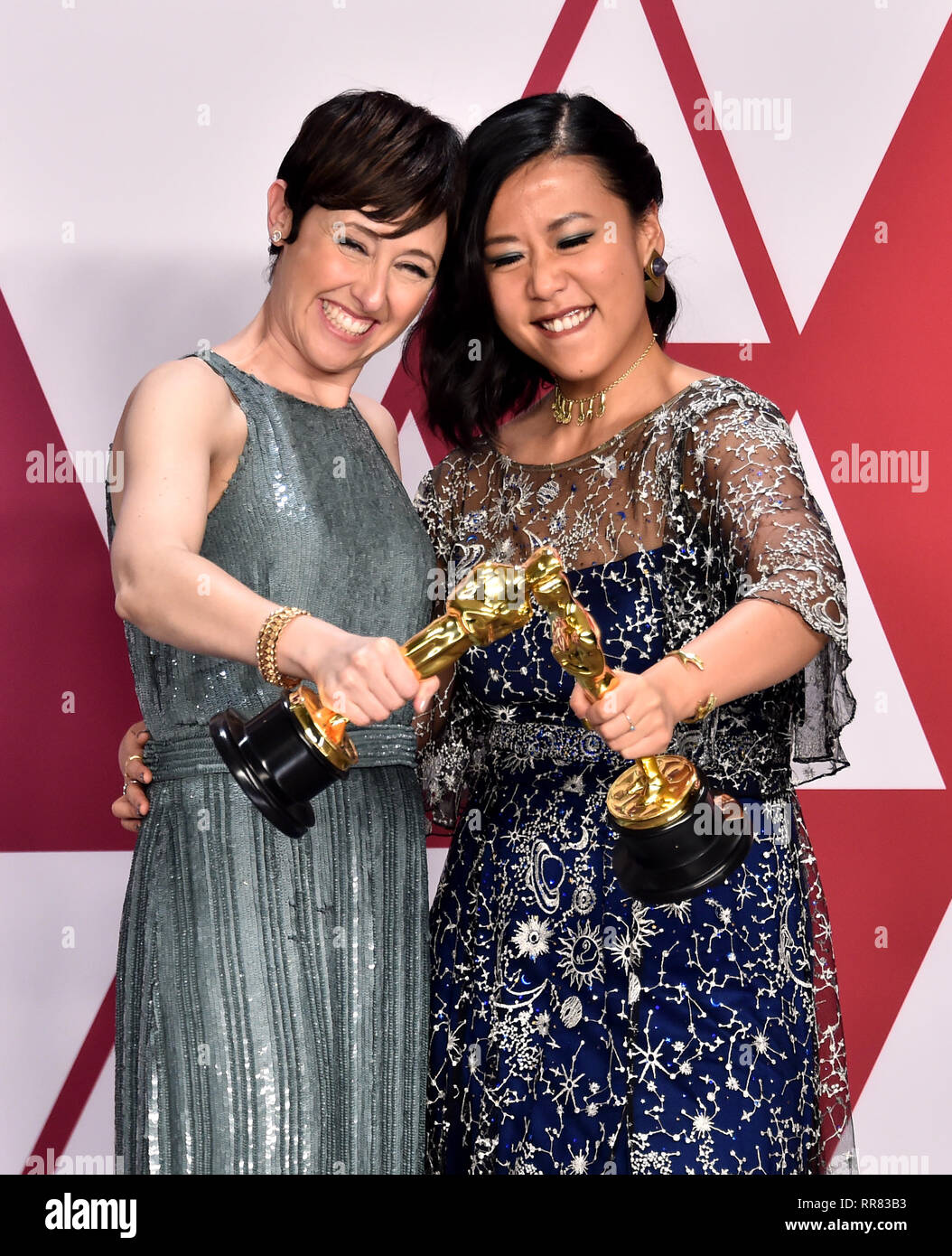 Becky Neiman-Cobb (left) and Domee She with the award for best short ...