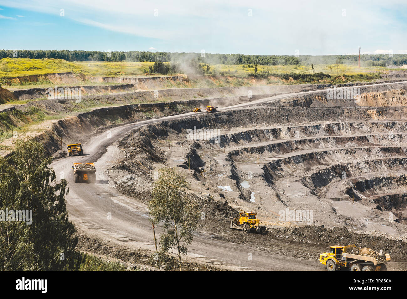 Large quarry dump truck. Loading the rock in dumper. Loading coal into body truck. Production ...