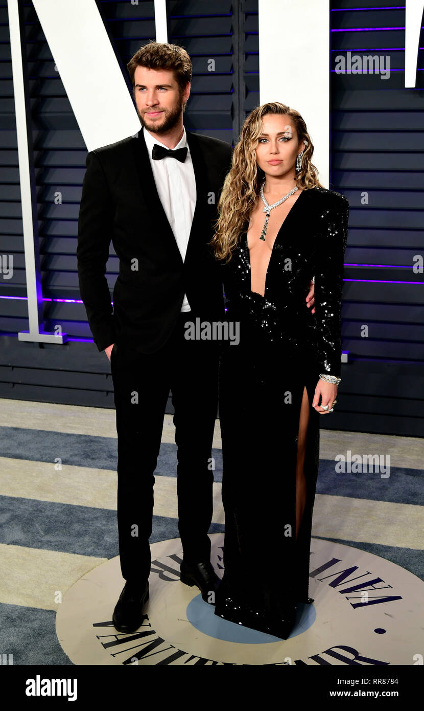Liam Hemsworth (left) and Miley Cyrus attending the Vanity Fair Oscar ...