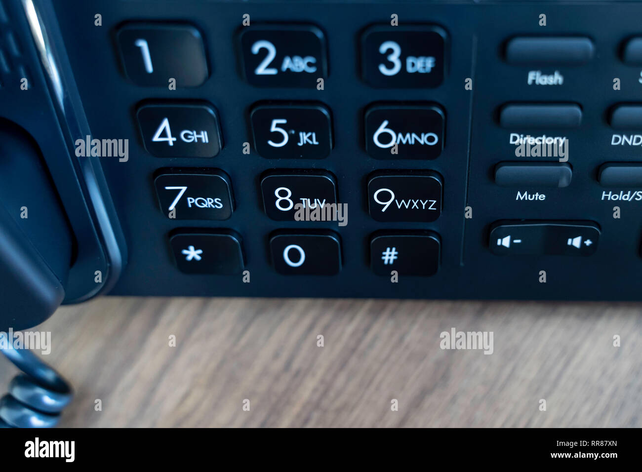 Office Telephone console on wood table Stock Photo - Alamy