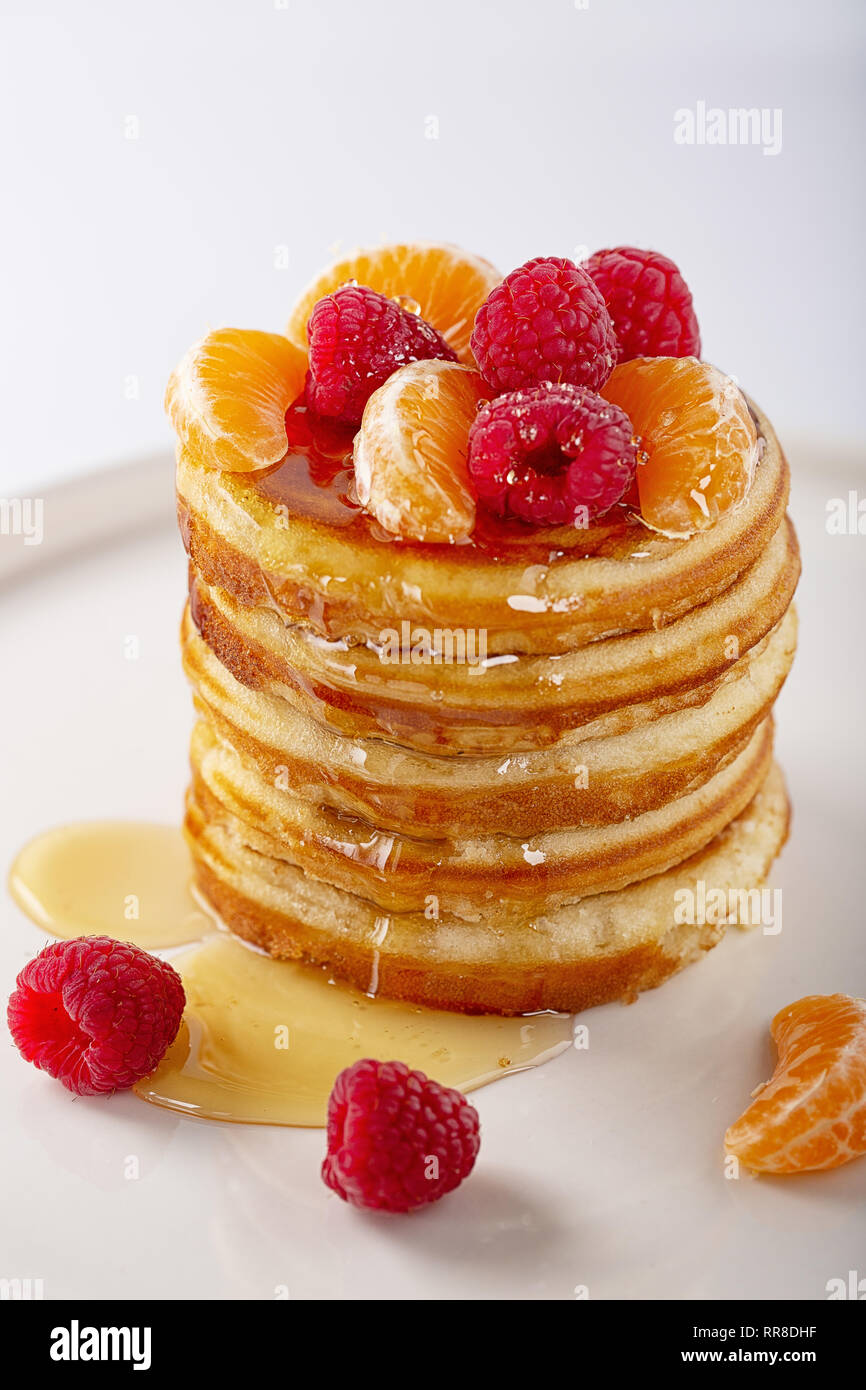 American Sweet homemade stack of pancakes or fritters with raspberry ...