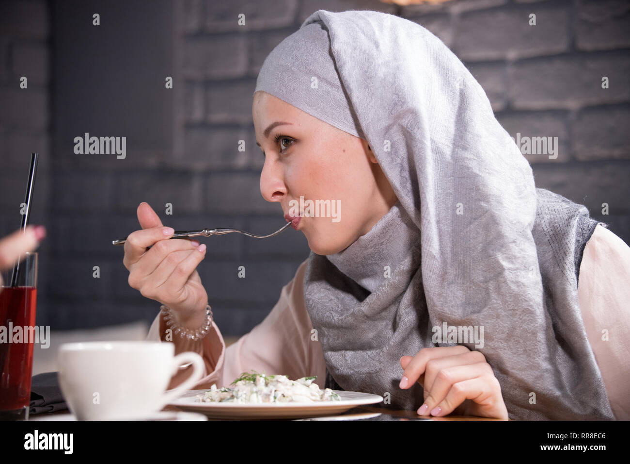 Female hijab food table hi-res stock photography and images - Alamy